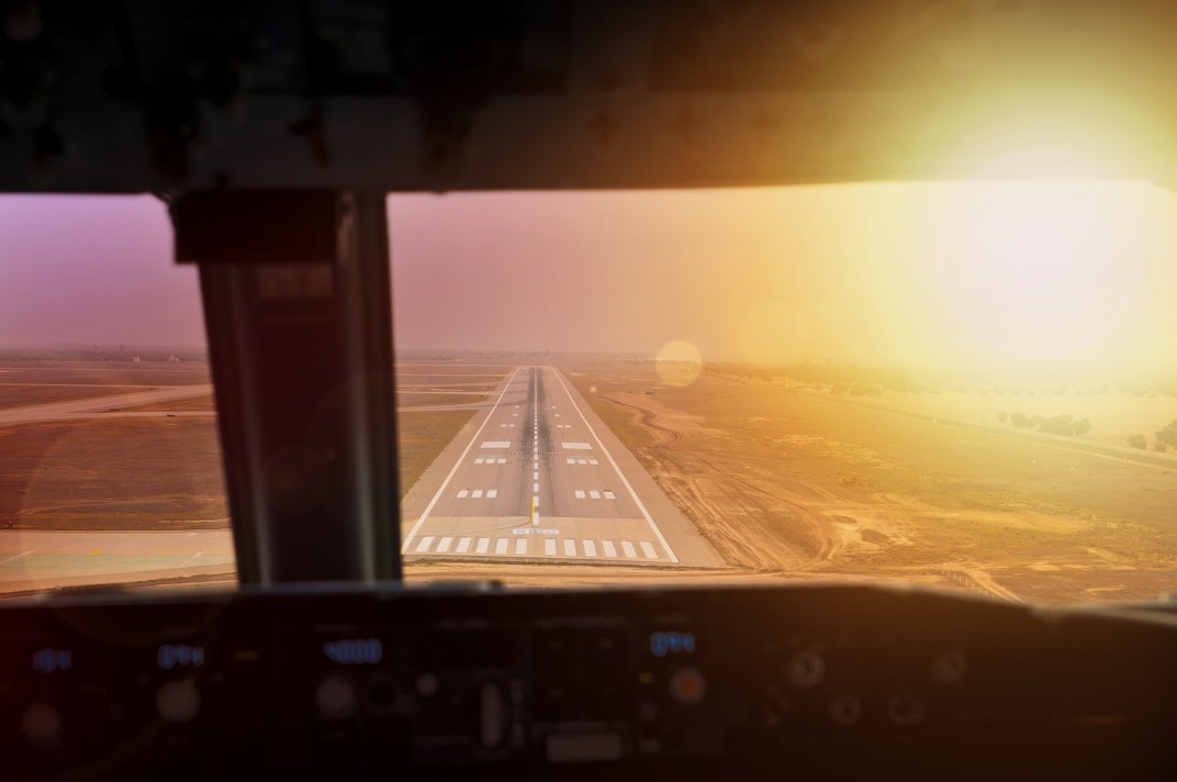 Travix | Final approach during sunset. View from flight deck